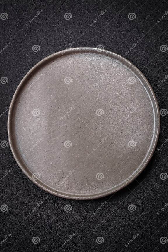 Bumpy Empty Ceramic Plate on a Textured Concrete Background Stock Image ...