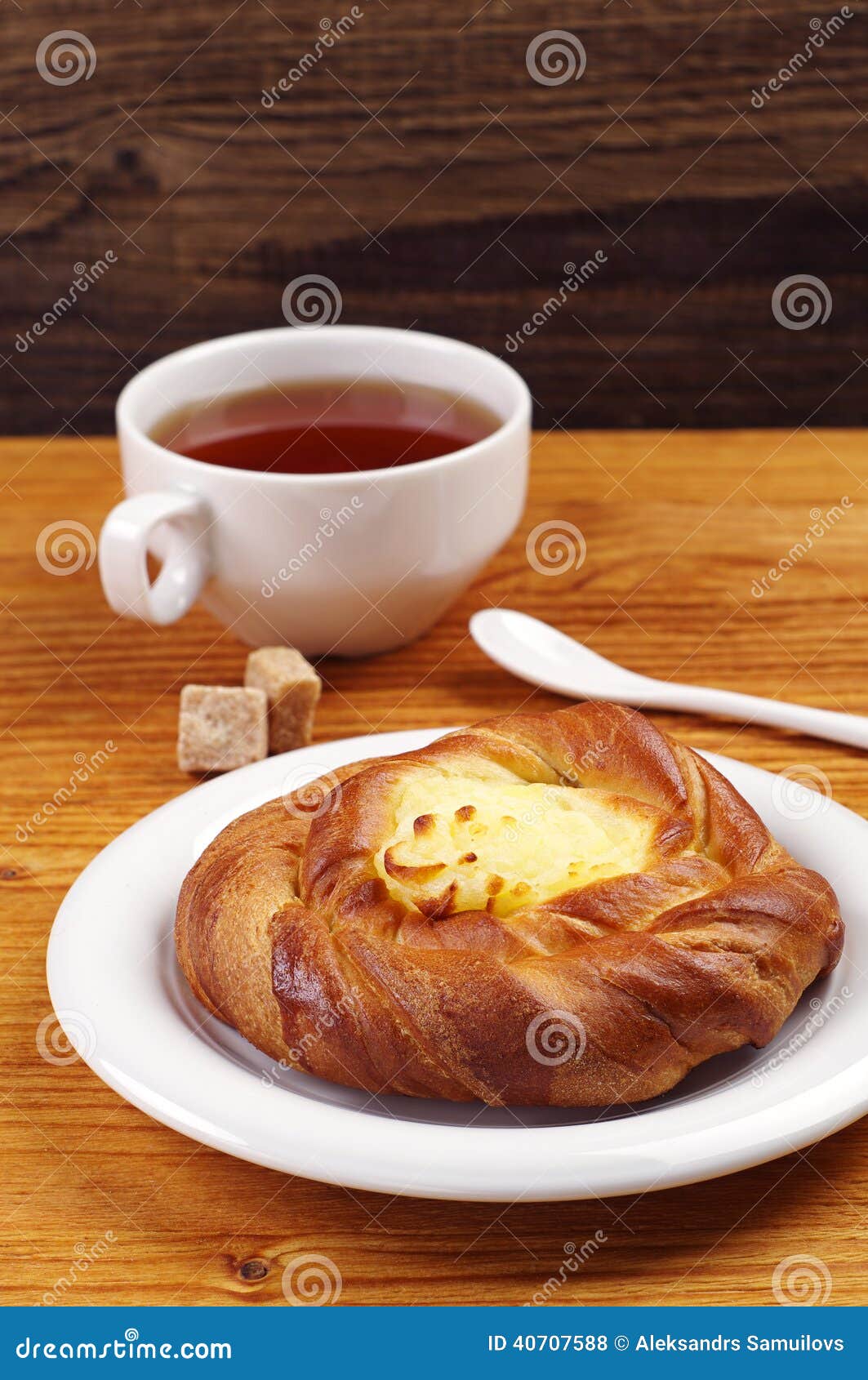 Bun with custard and tea stock photo. Image of drink - 40707588