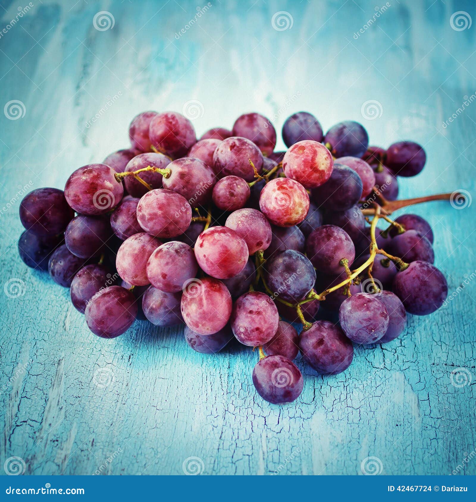 Bunch of Blue Grapes on Blue Background Stock Photo - Image of organic ...