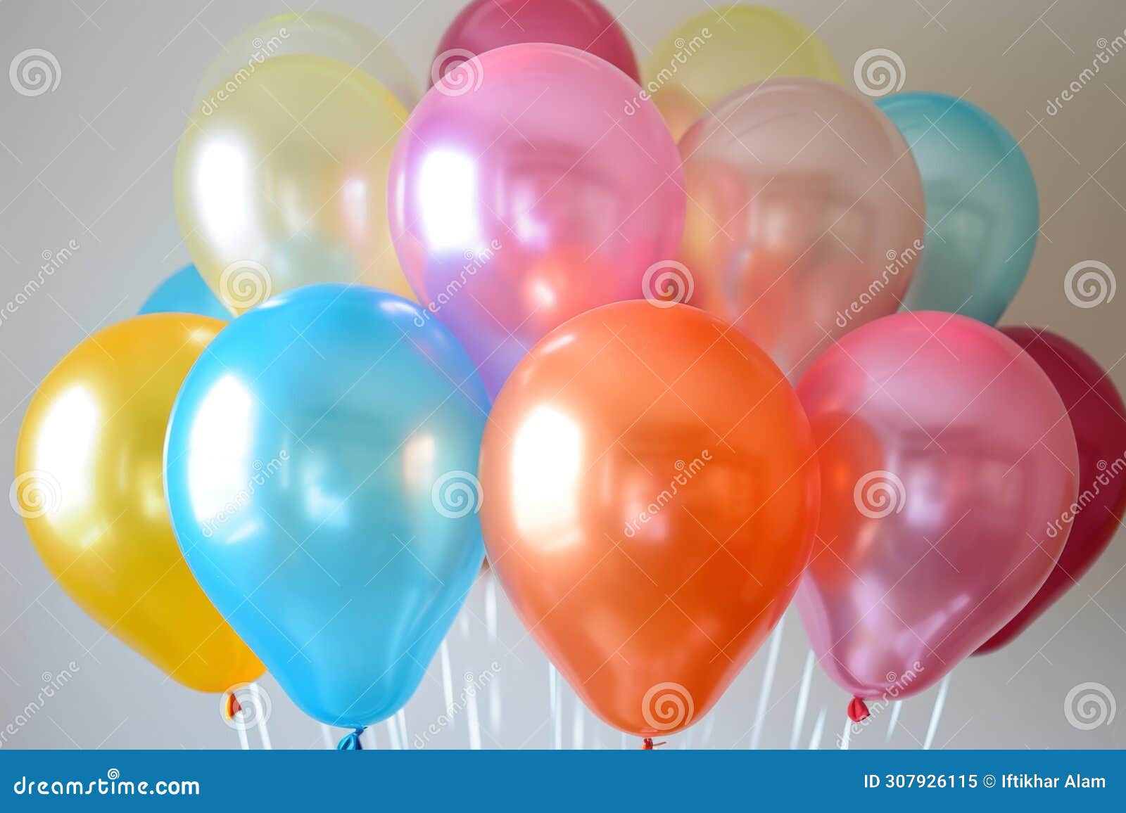 A Bunch Of Brightly Colored Balloons Effortlessly Float In The Air