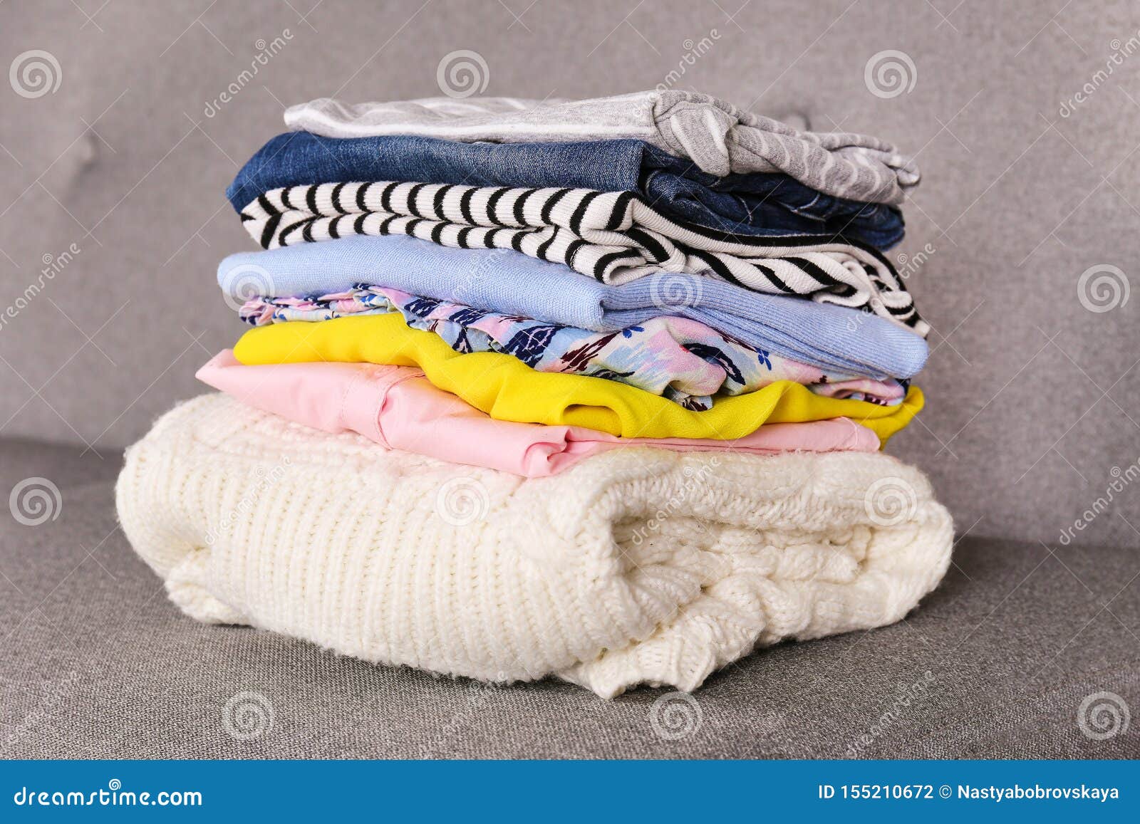 Bunch of Different Colorful Clothing Items Folded in Stack Stock Photo ...