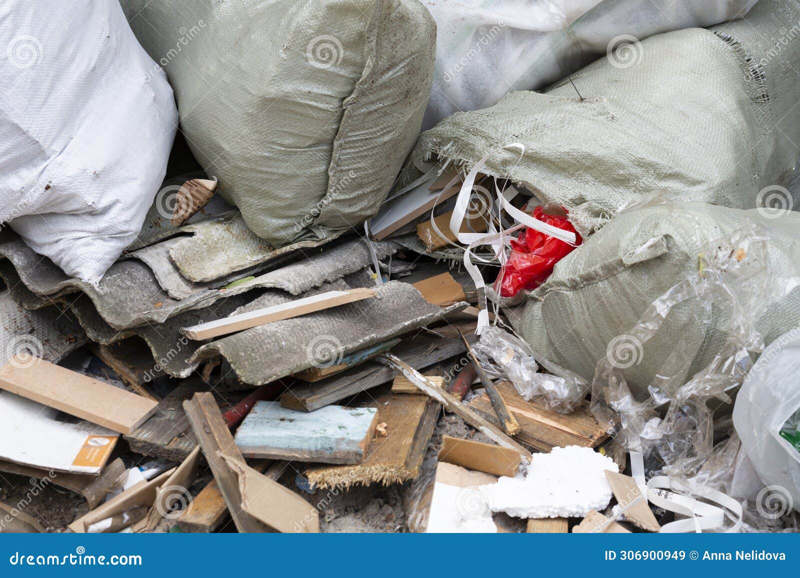 Bunch of Construction Debris in White Bags Near a New Building, Garbage ...