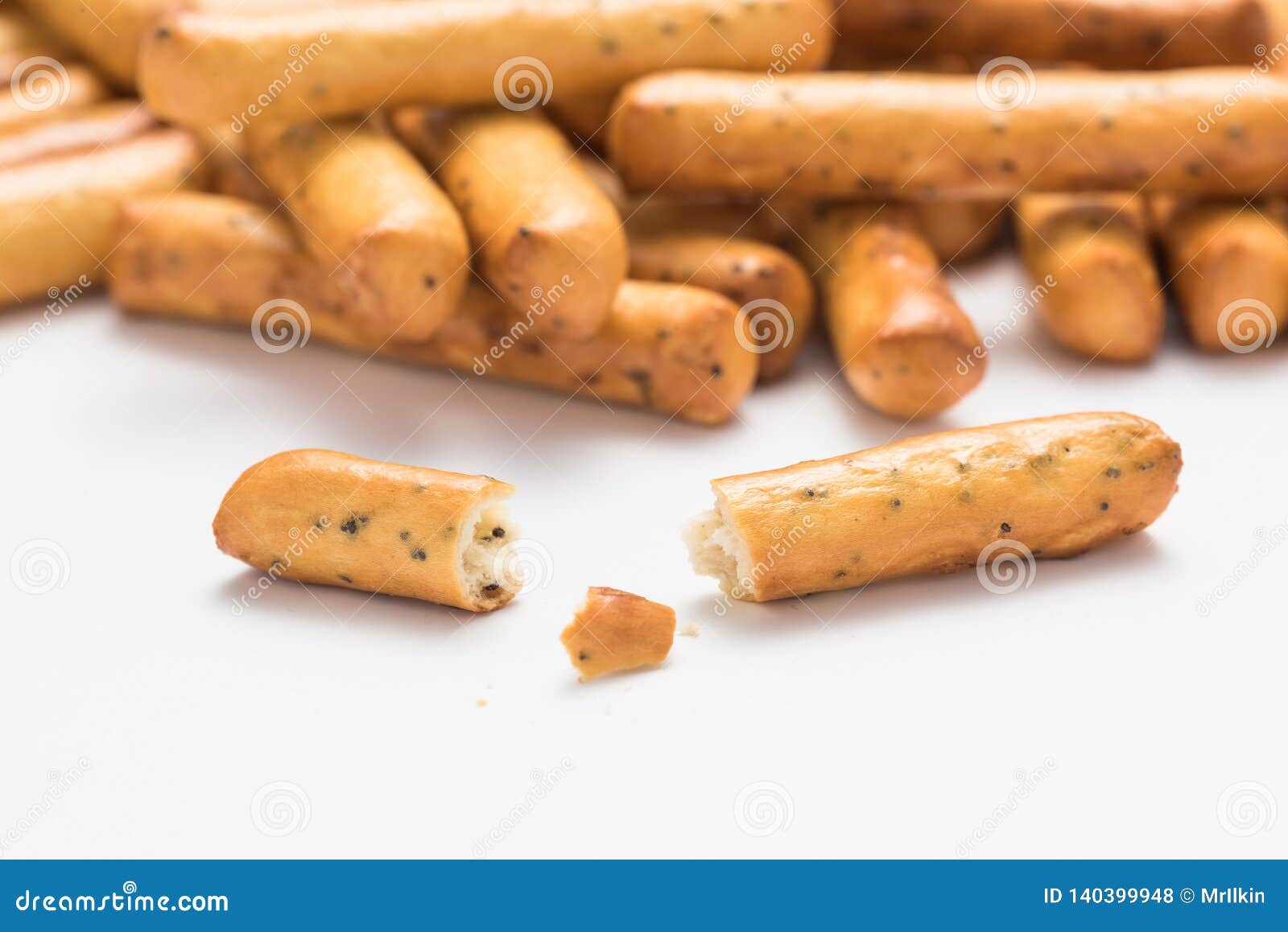 A Bunch of Crispy Breadsticks with Poppy Seeds with a Broken Stick in ...