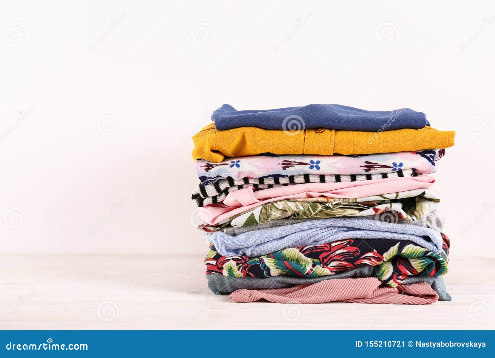 Bunch of Different Colorful Clothing Items Folded in Stack Stock Image ...