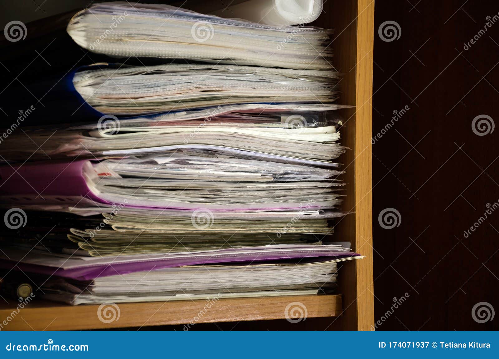 A Bunch of Different Documents on a Shelf in an Office Cupboard. Place ...