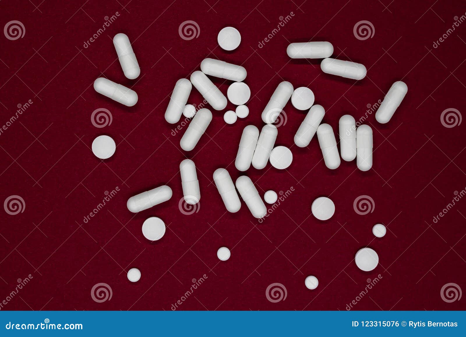 Bunch of Different Forms White Medication Pills on Burgundy Background ...