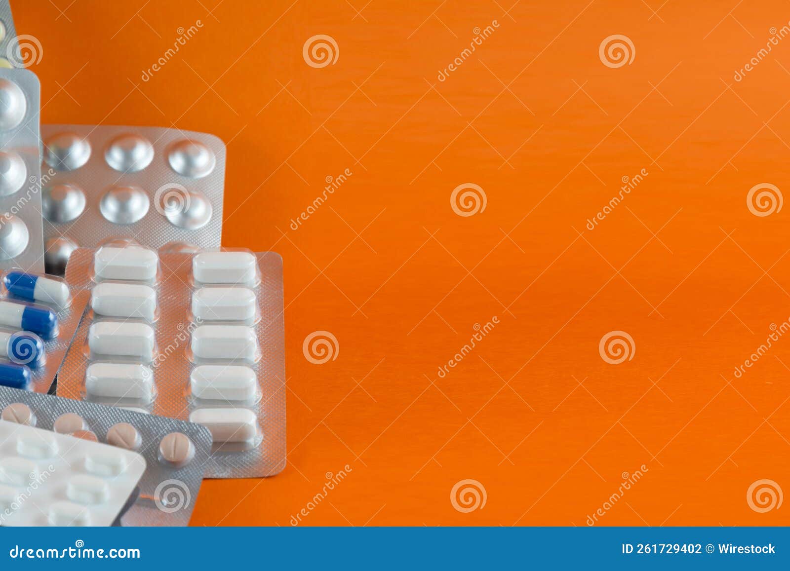 Bunch of Different Pills Stacked on an Orange Background Stock Photo ...