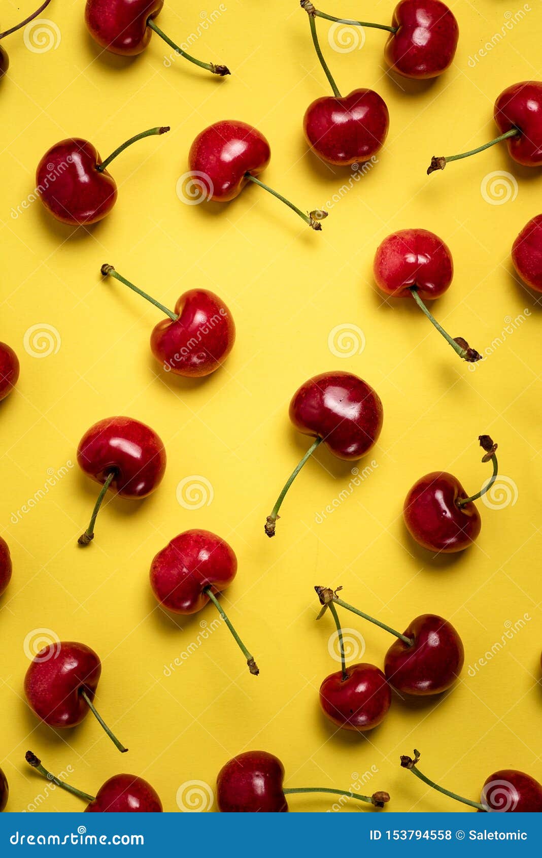 Bunch of Fresh Cherries on Yellow Stock Photo - Image of heirloom ...