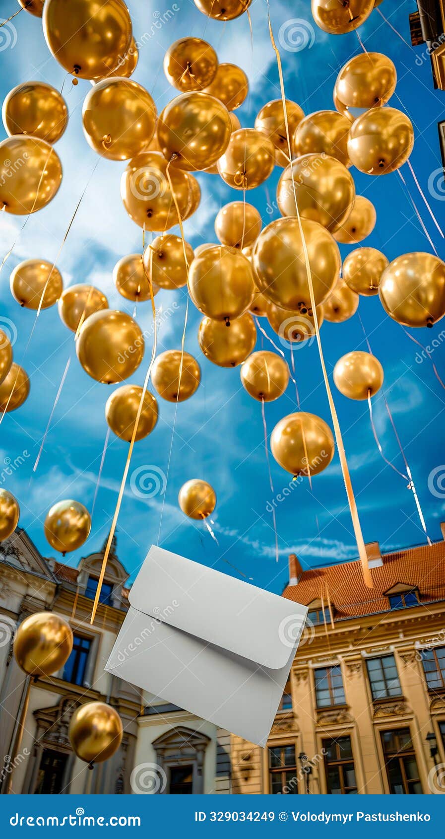 A Bunch of Gold Balloons Floating in the Air with a White Envelope ...