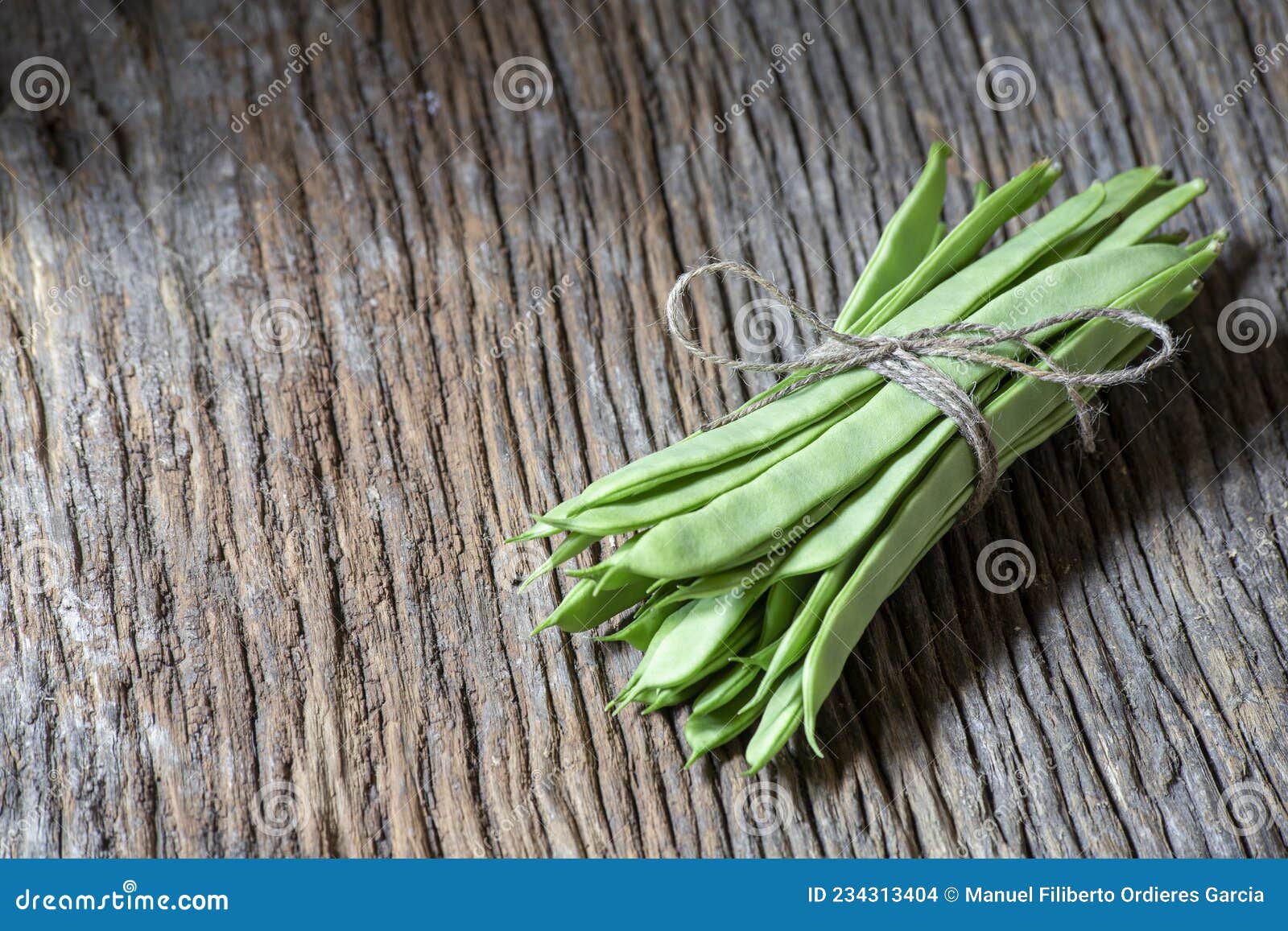 Bunch of Green Flat Beans Tied with a String on an Old Wooden Plank ...