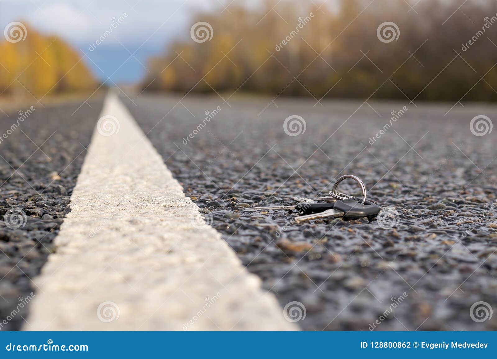A Bunch of Keys Lies on the Asphalt Surface of the Roadway Stock Photo ...