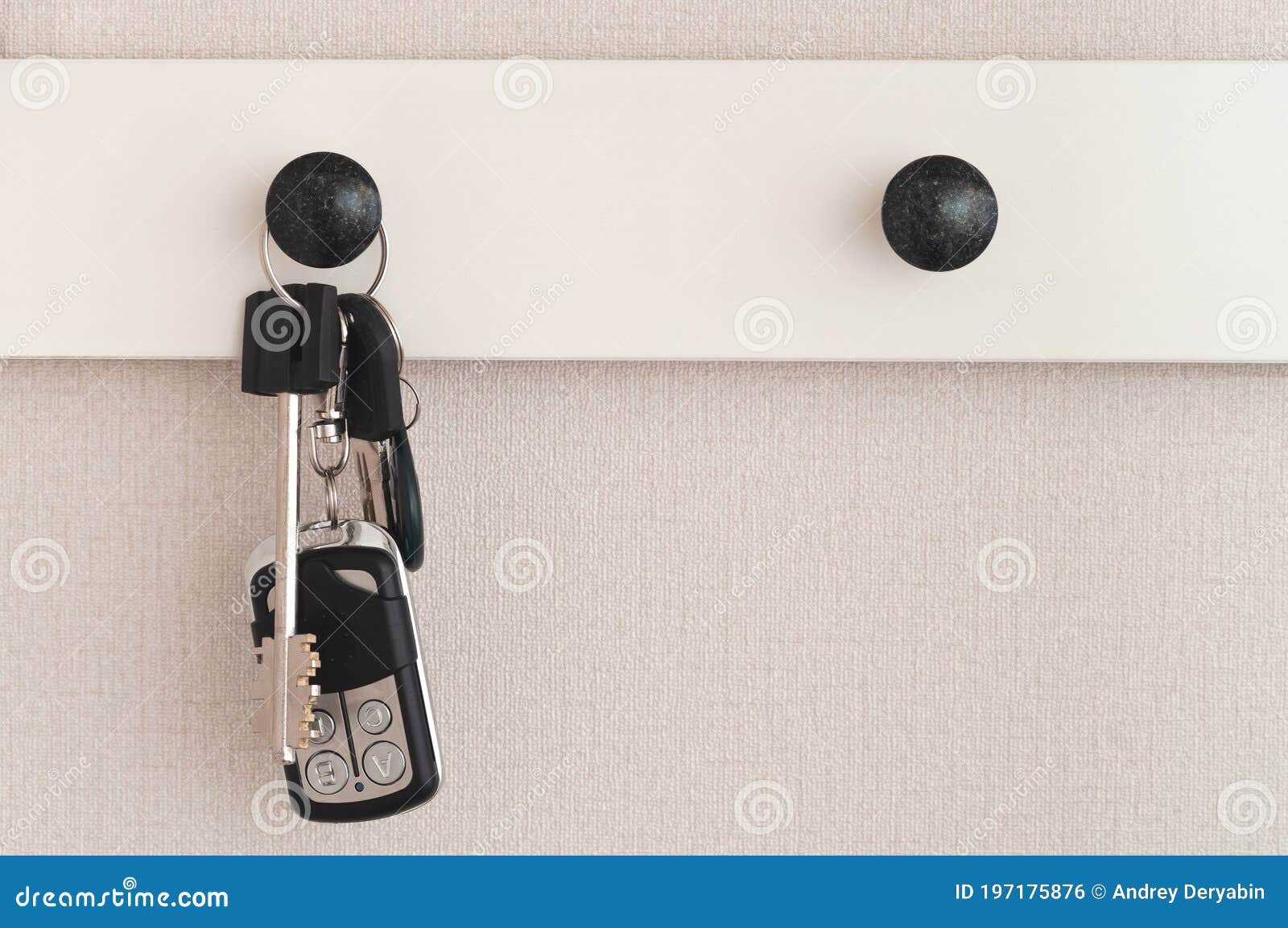 A Bunch of Modern Keys Hangs on a Clothes Hook in the Hallway. Closeup ...