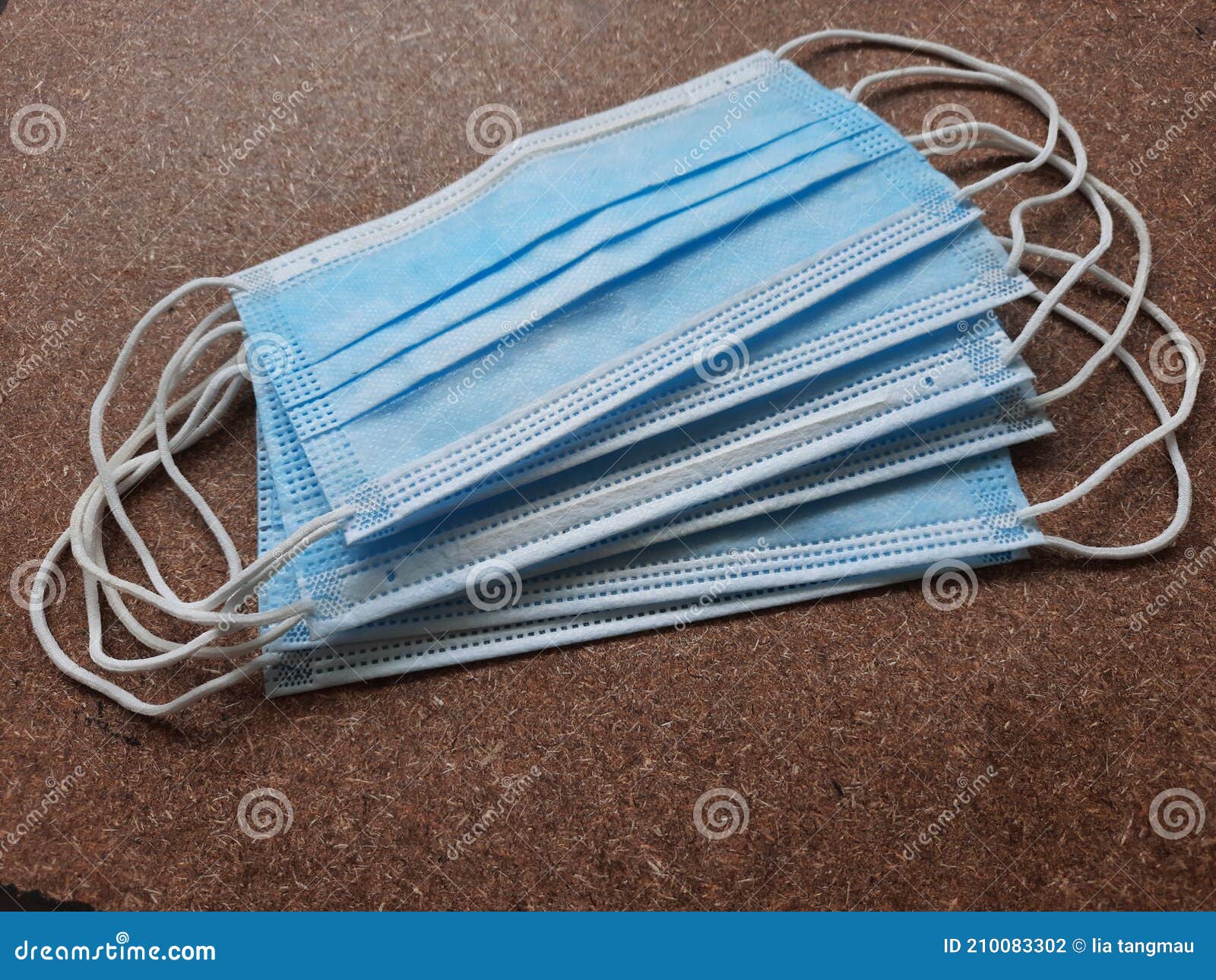 A Bunch Of Masks Which Are Blue In Color Are Kept On A Floor .corona ...
