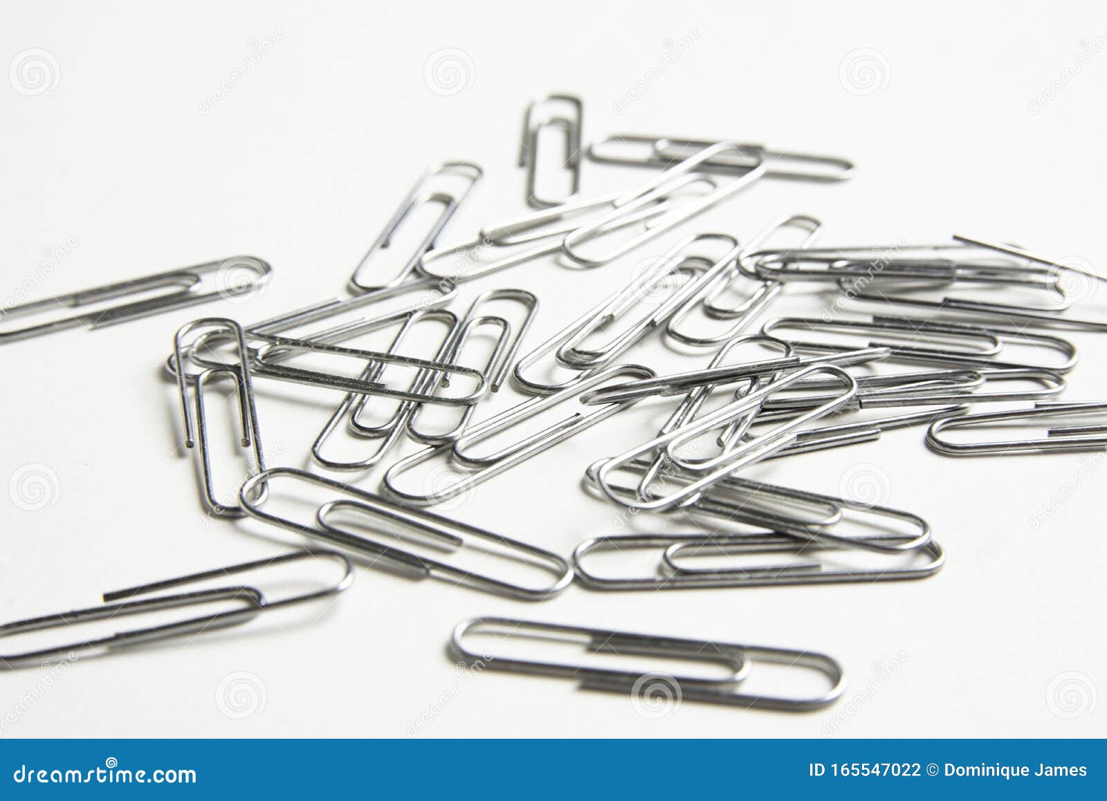 A Bunch of Paper Clips stock photo. Image of organized - 165547022