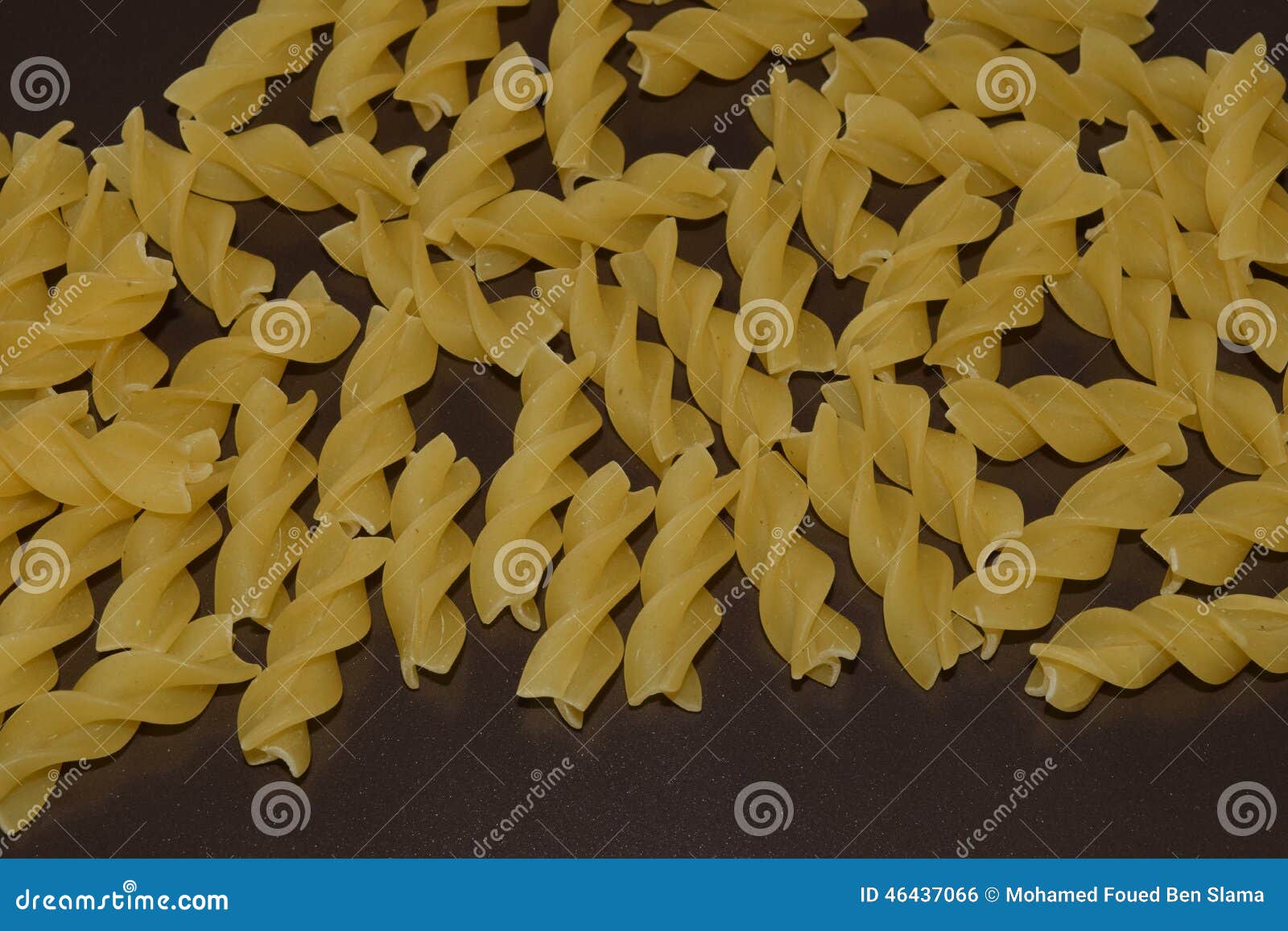 Bunch of raw pasta fusilli stock photo. Image of fusilli - 46437066