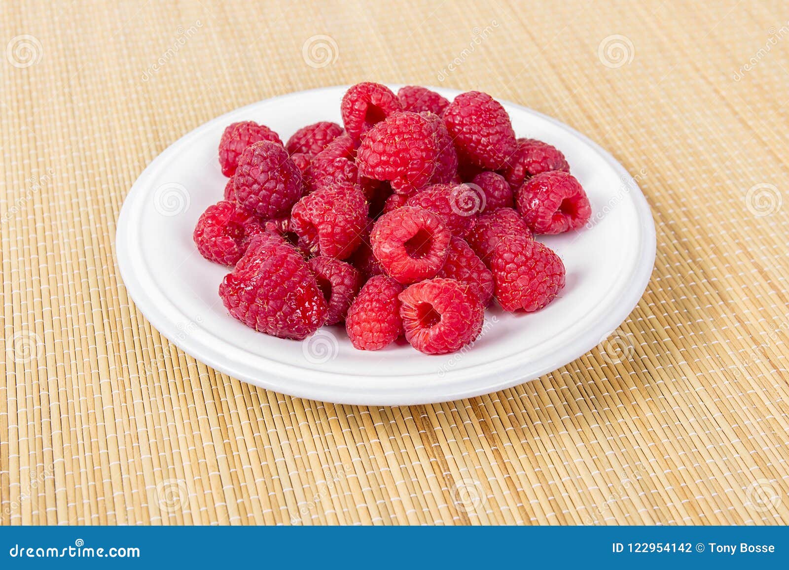 Red Raspberries on a Plate stock photo. Image of grocery - 122954142