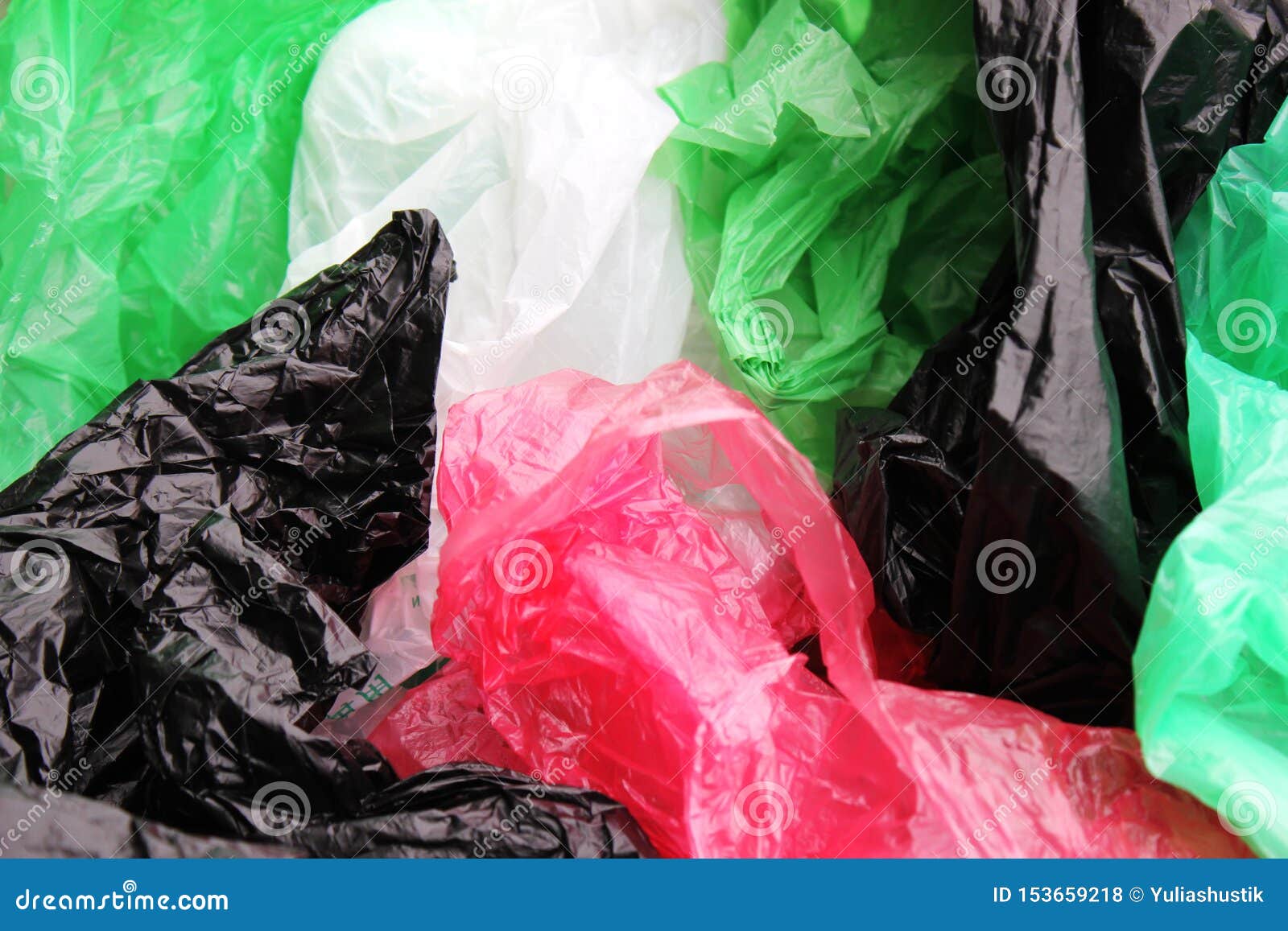 A Bunch of Reusable, Multi-colored Plastic Bags Polluting the ...