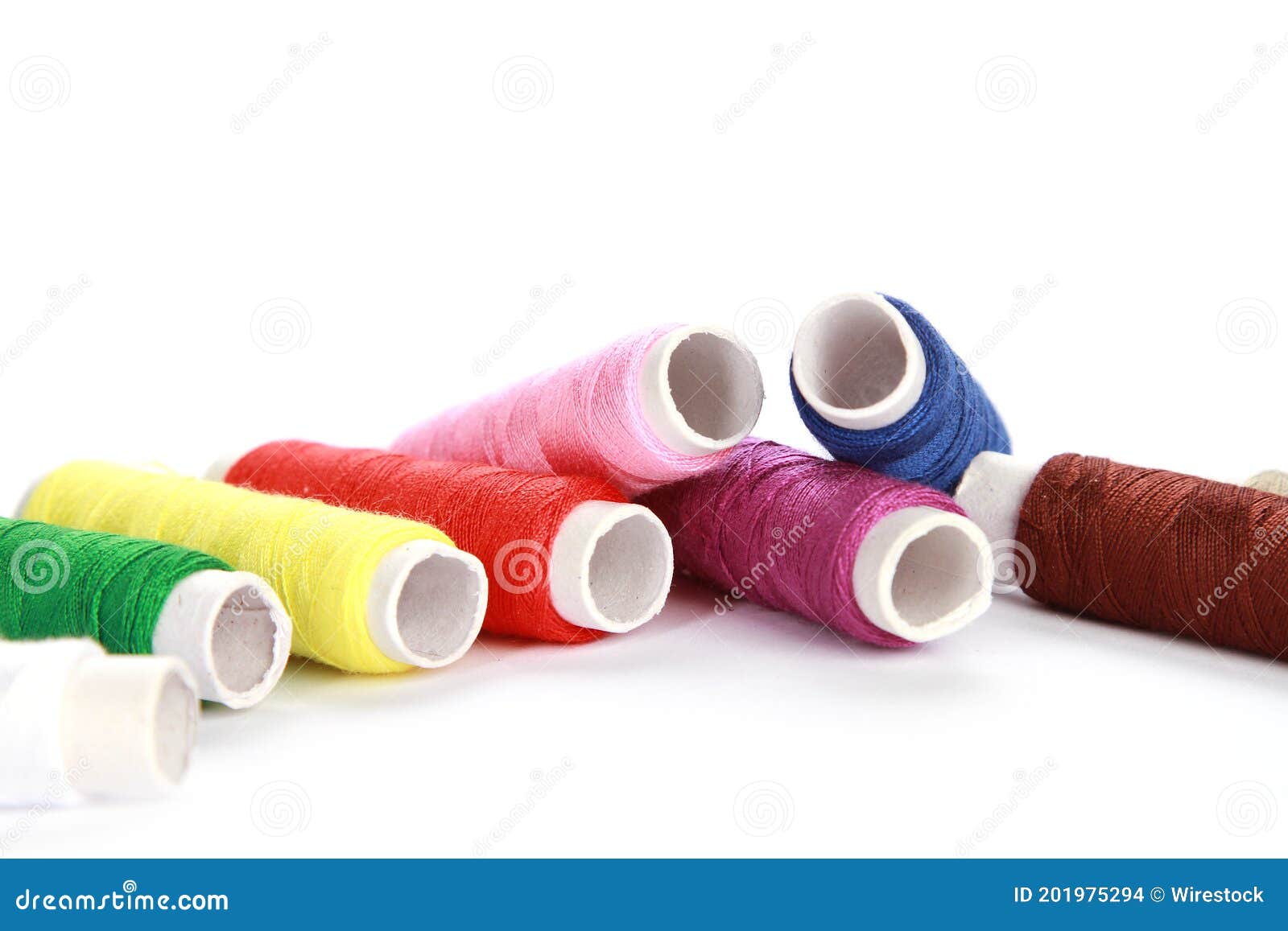 Bunch of Rolls of Colorful Thread on a White Surface Stock Photo ...