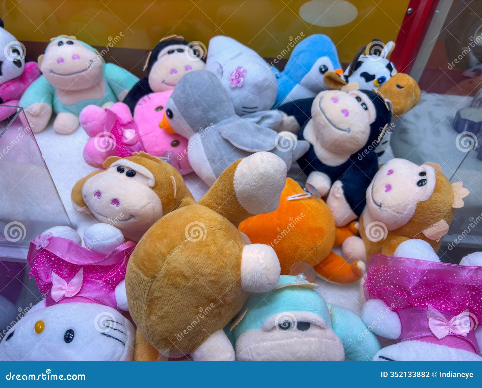 A Bunch of Stuffed Animals are in a Display Case, Including Hello Kitty ...