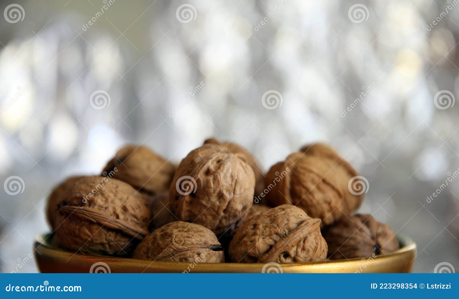 Bunch of Walnuts in a Bowl with Gold Rim and Boked Effect in the ...