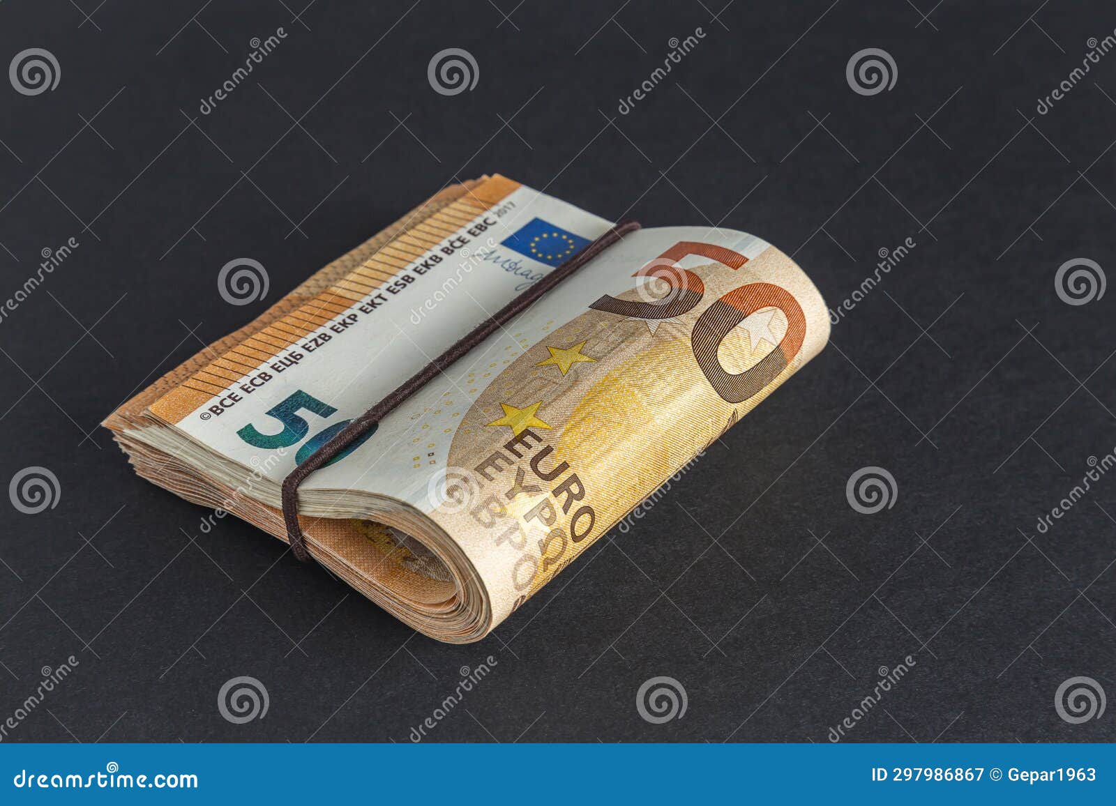 Bundle of 50 Euro Banknotes on a Table on a Black Background Stock ...