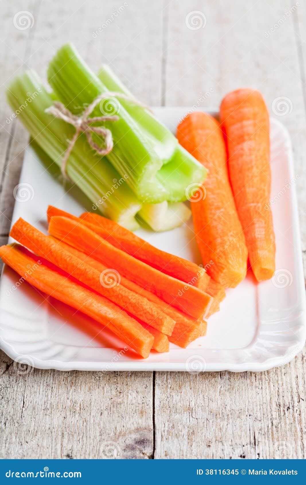 Bundle of Fresh Green Celery Stems and Carrot in Plate Stock Image ...