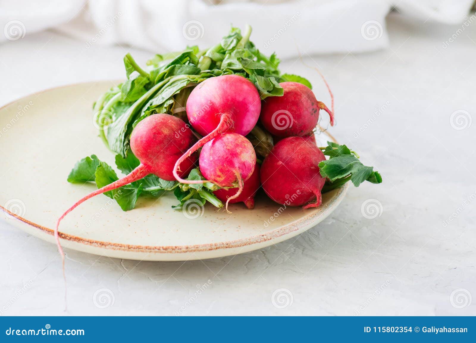 Bundle of Fresh Ripe Radishes in a Plate. White Background Stock Photo ...