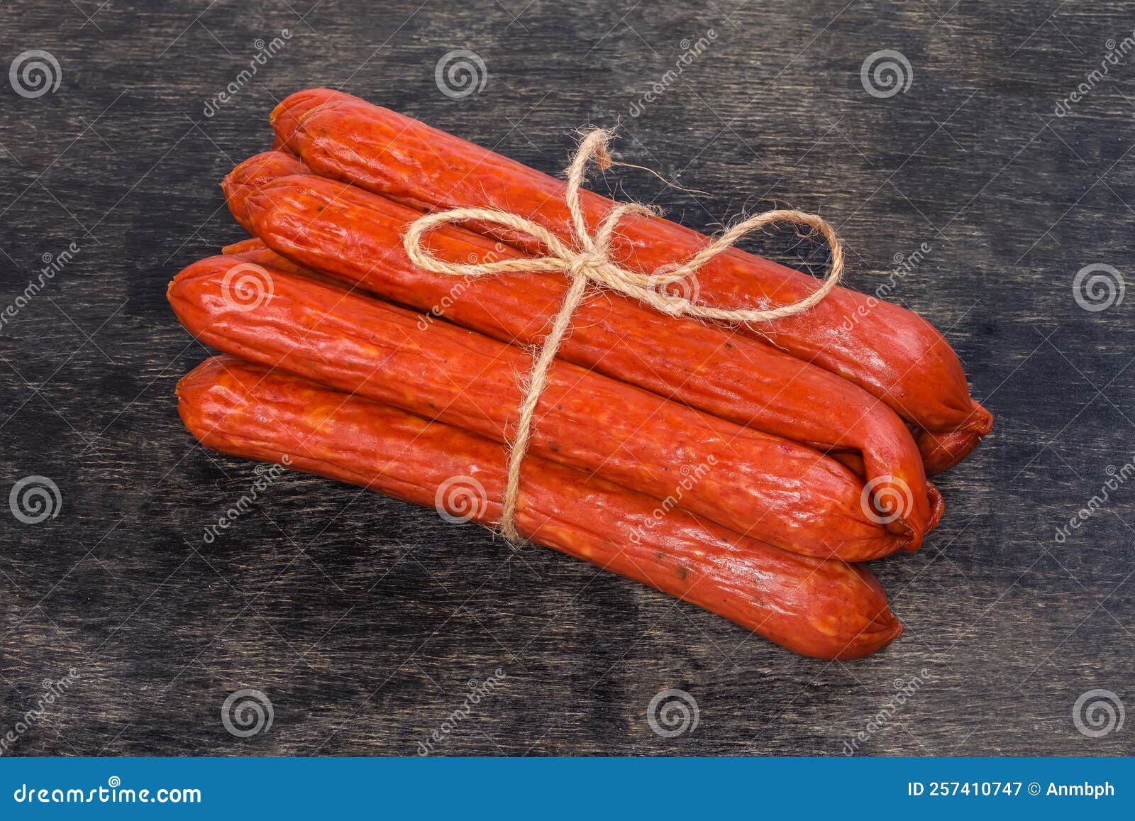 Bundle of Long Thin Smoked Sausages on the Black Surface Stock Image ...