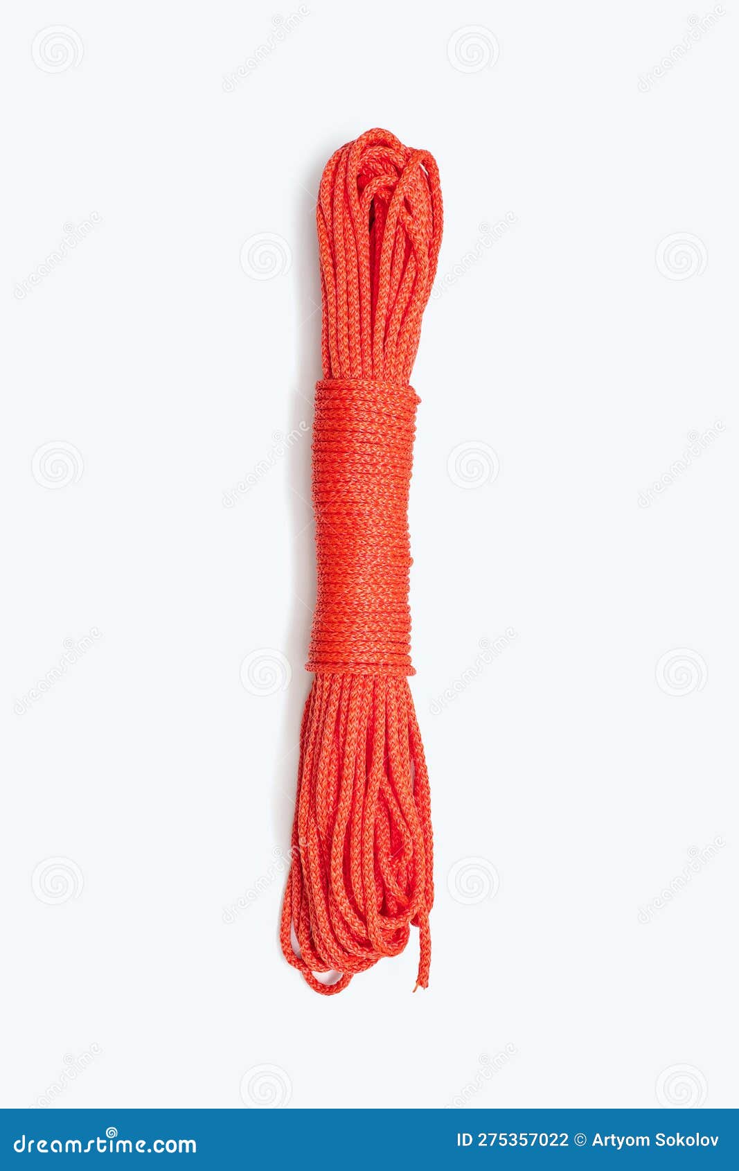 Bundle of Neatly Twisted Red Nylon Rope on a White Vertical Background ...