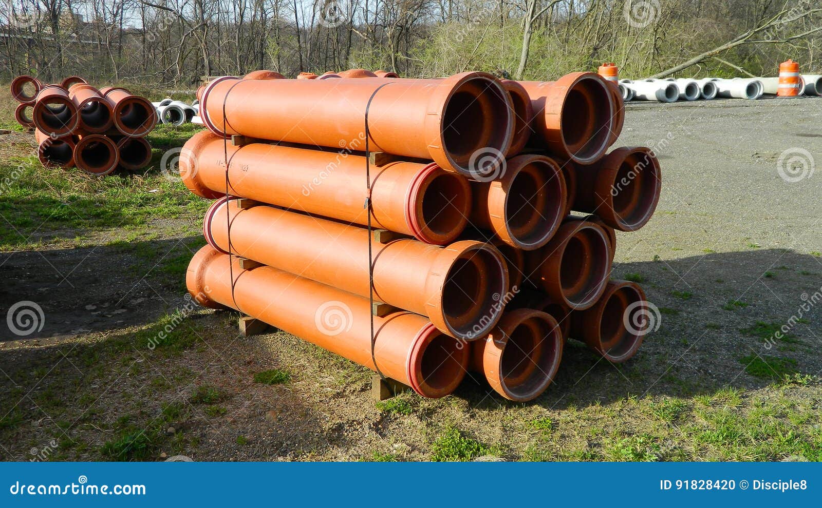 Bundle of New Red Drainage Pipes Stock Photo - Image of road ...
