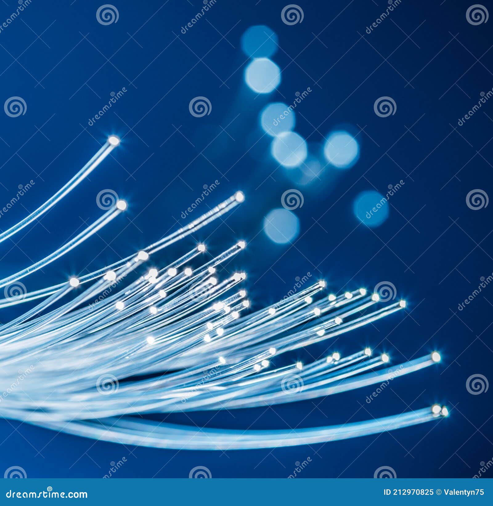 Bundle of Optical Fibers with Lights in the Ends. Blue Background Stock ...