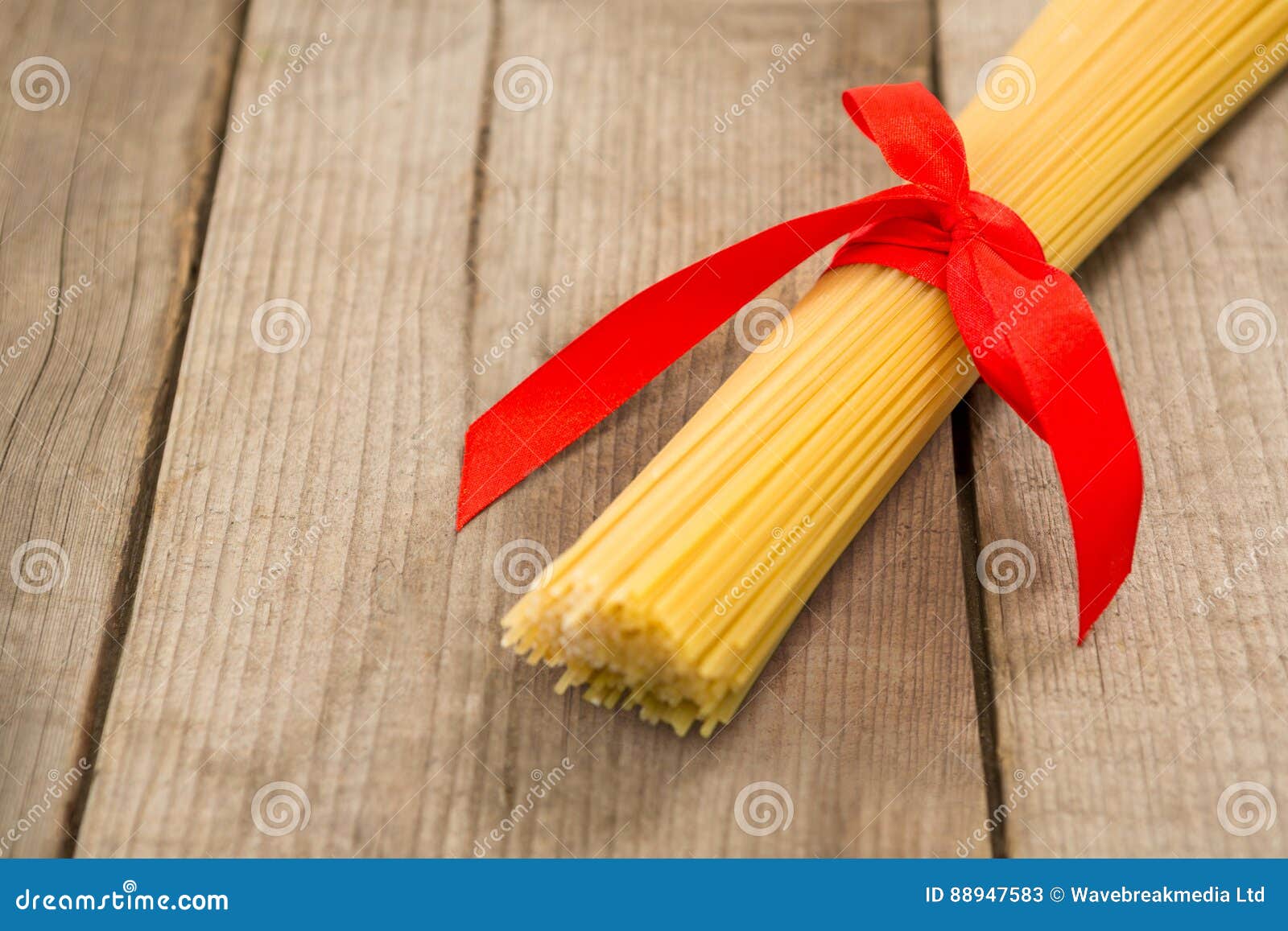 Bundle of Raw Spaghetti Tied with Red Ribbon Stock Image - Image of ...