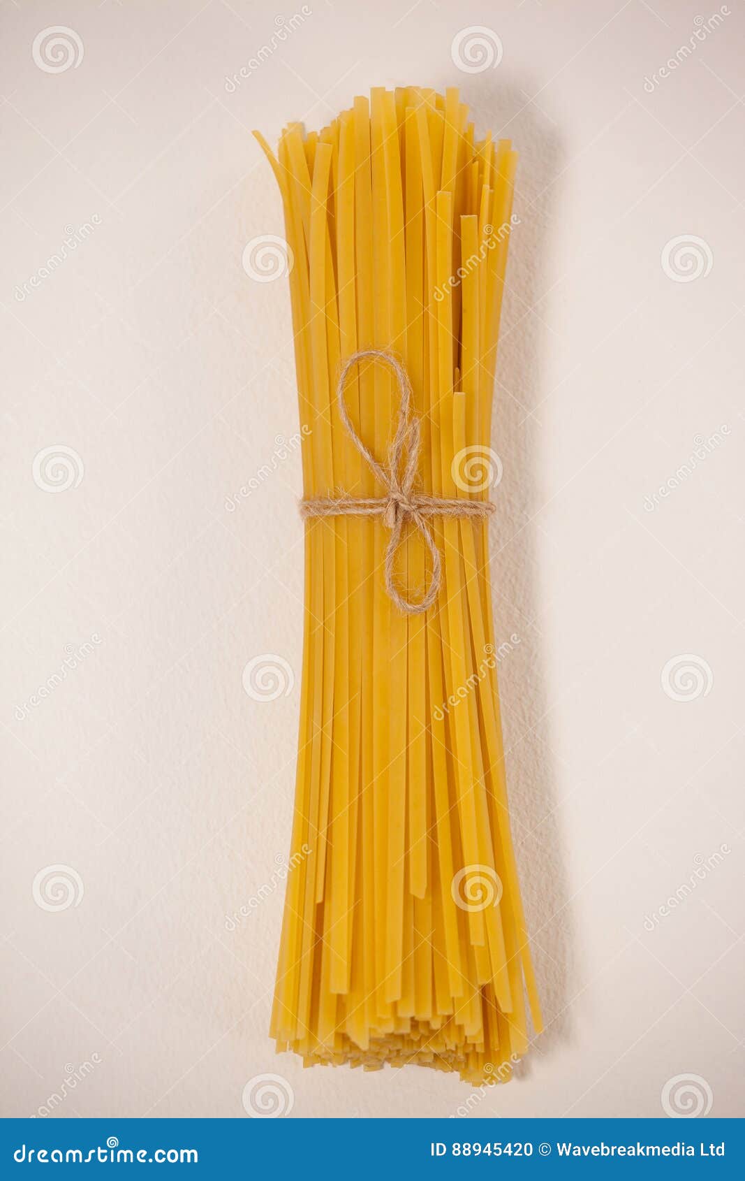 Bundle of Raw Spaghetti Tied with Rope Stock Photo - Image of meal ...