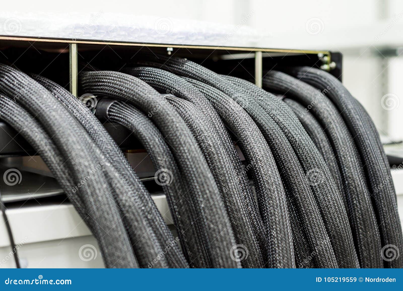 A Bundle of Thick Cables in Plastic Sheath. a Lot of Cables Enter the ...
