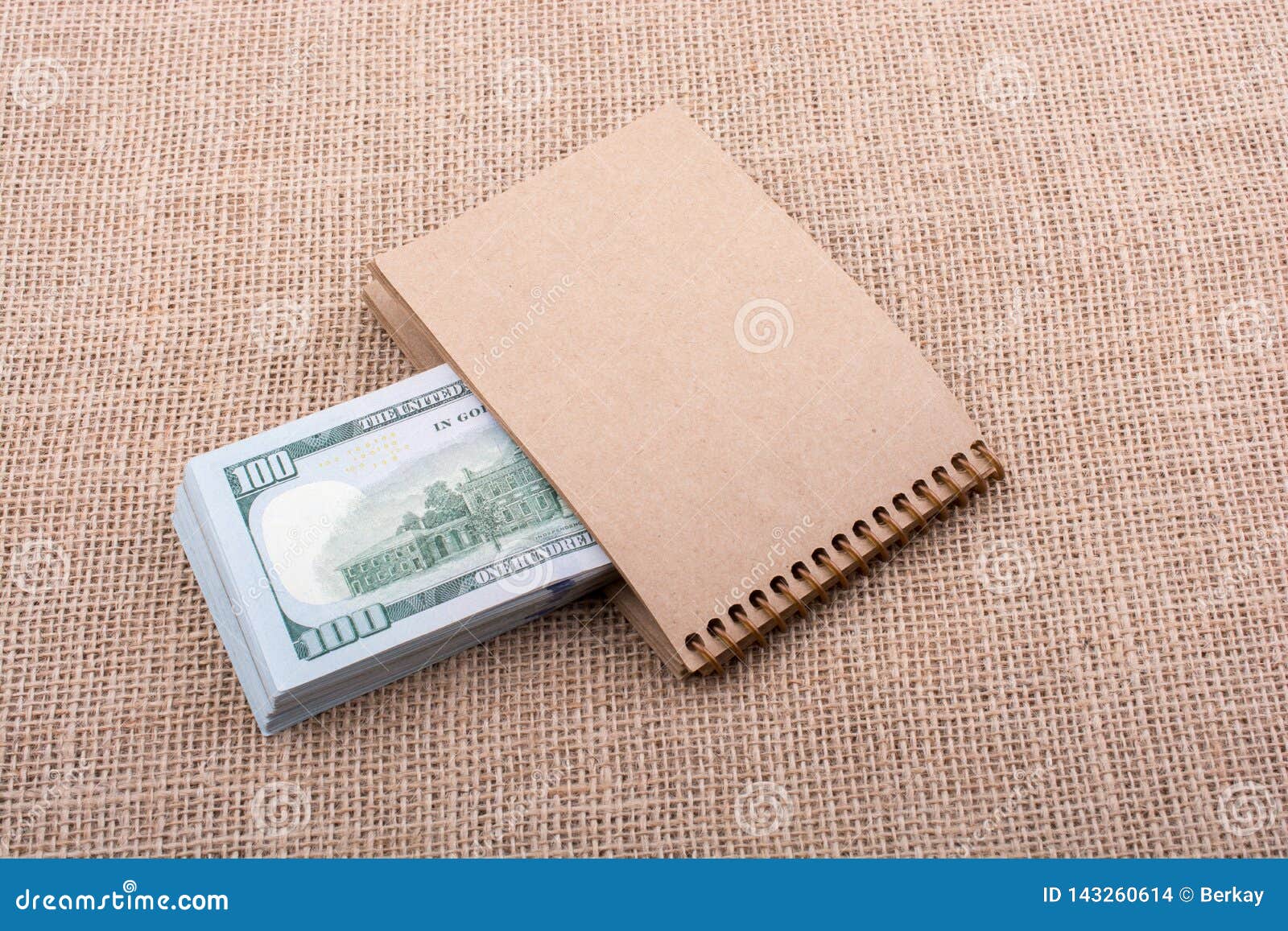 Bundle of US Dollar on a Notebook Stock Photo - Image of notebook ...