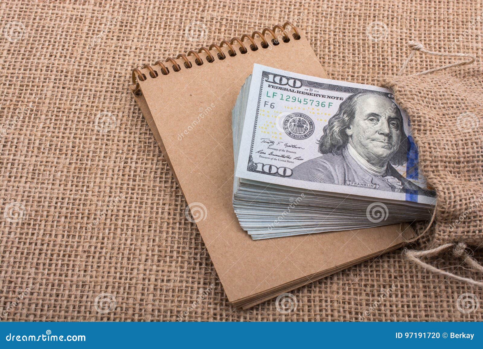 Bundle of US Dollar on a Notebook Stock Photo - Image of stack ...