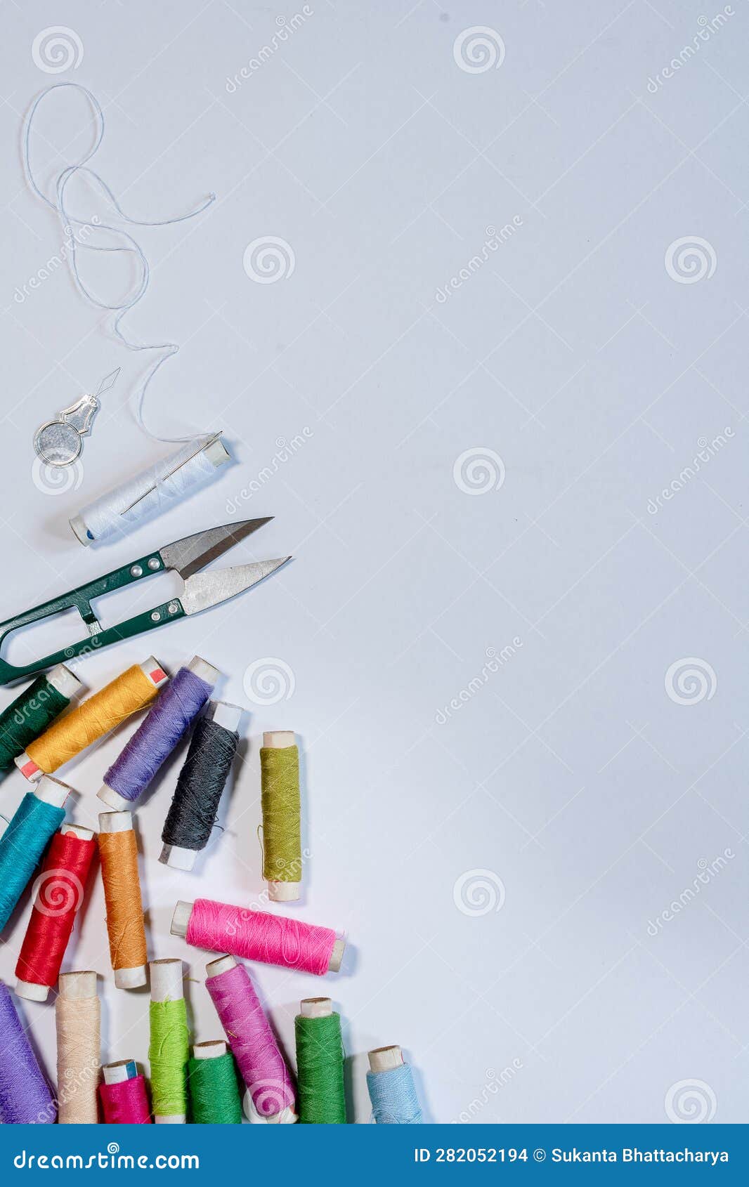 A Bundle of Various Color Thread Spools of the Sewing Machine with a ...