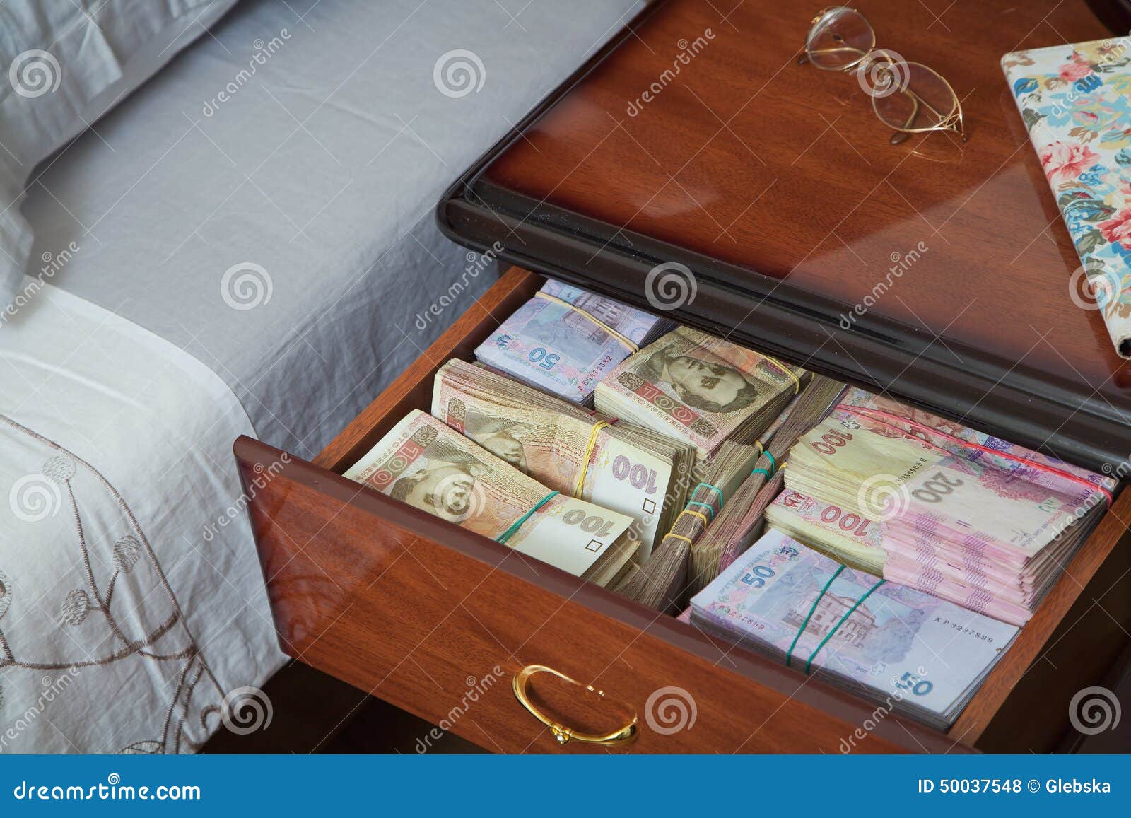 Bundles of Banknotes in Bedside Table Stock Photo - Image of budget ...