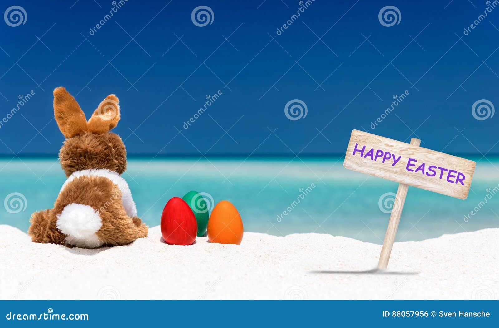 Bunny, Easter Eggs and Happy Easter Sign on a Beach Stock Photo - Image ...