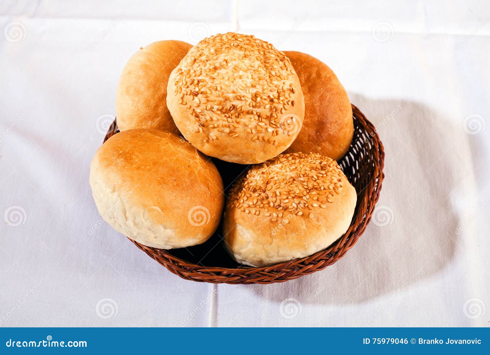 Buns in a basket stock photo. Image of soft, golden, seeds - 75979046