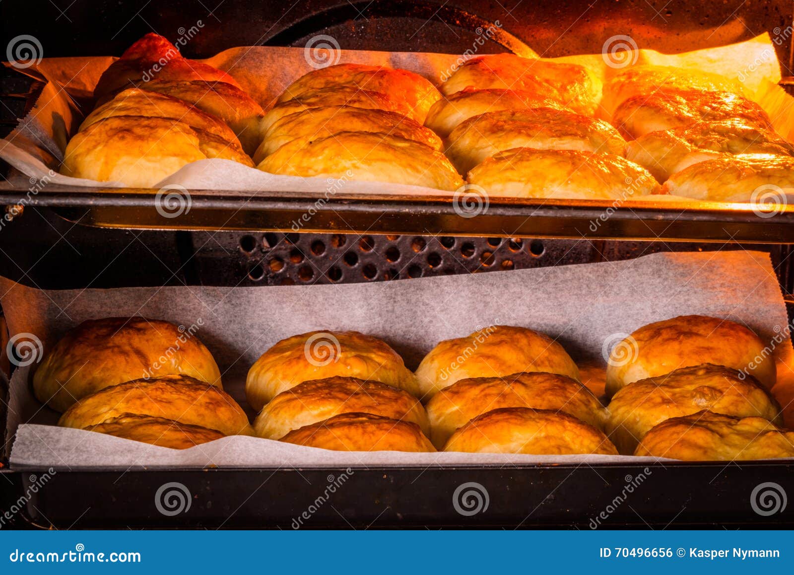 Buns in a hot oven stock photo. Image of kitchen, inside - 70496656