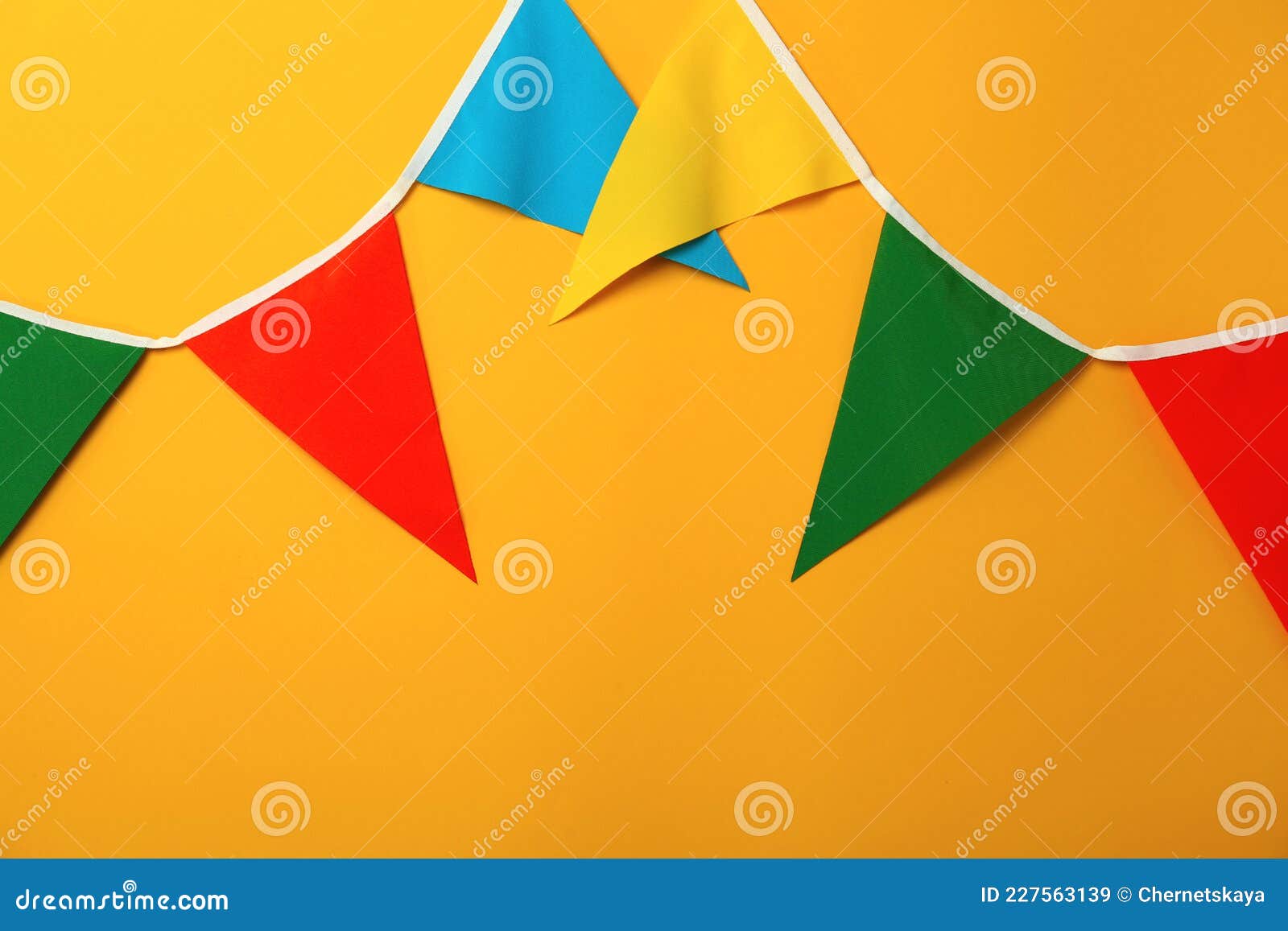 Bunting with Colorful Triangular Flags on Orange Background Stock Image ...