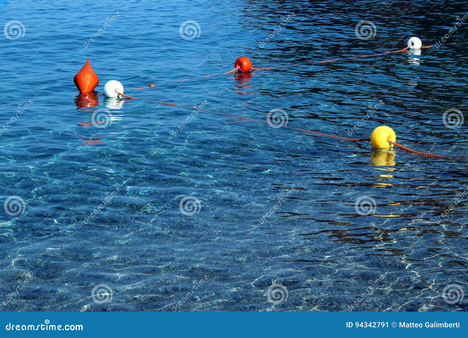 Buoys floating on the sea stock image. Image of cool - 94342791
