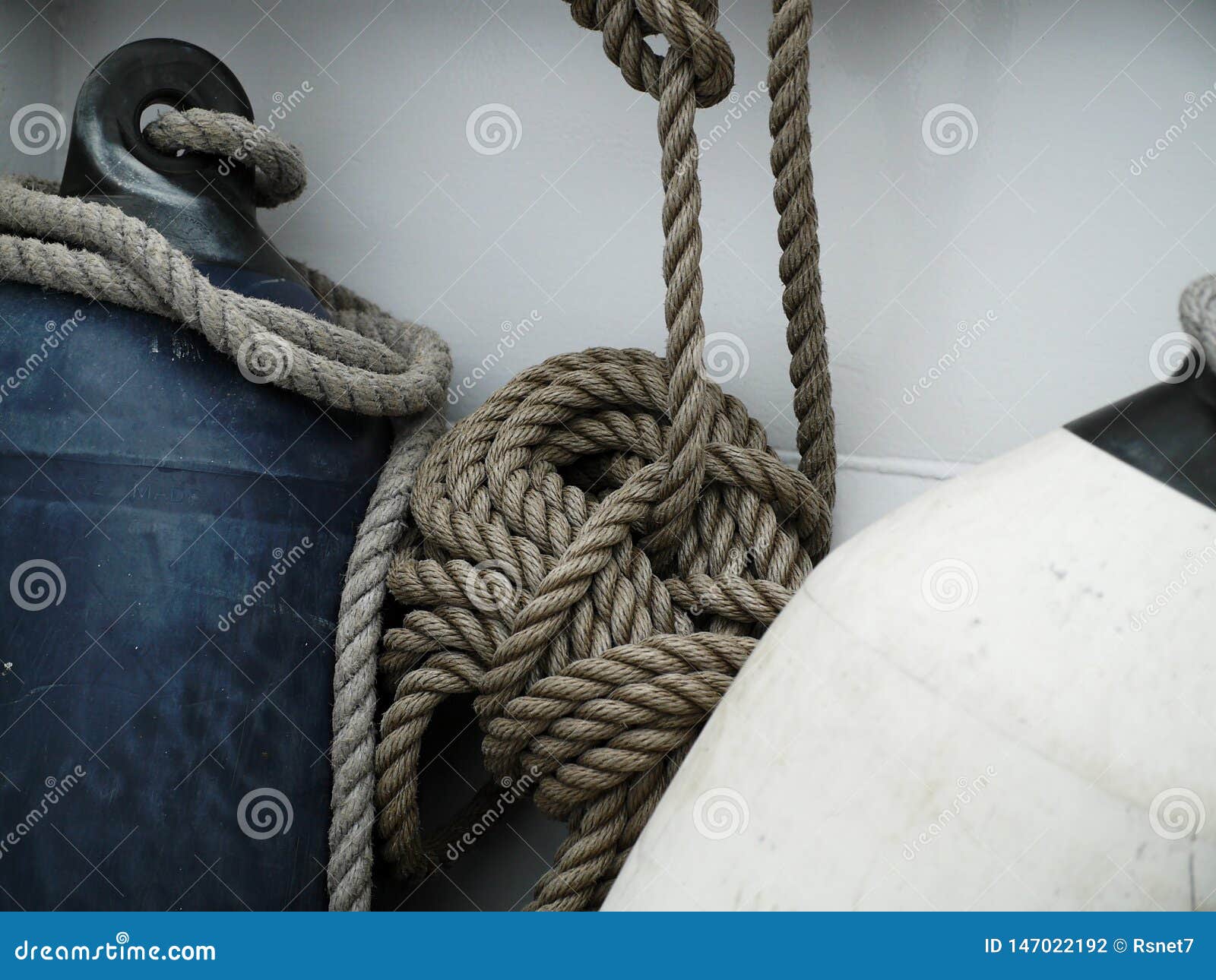 Buoys and rolled rope stock photo. Image of pulley, close - 147022192