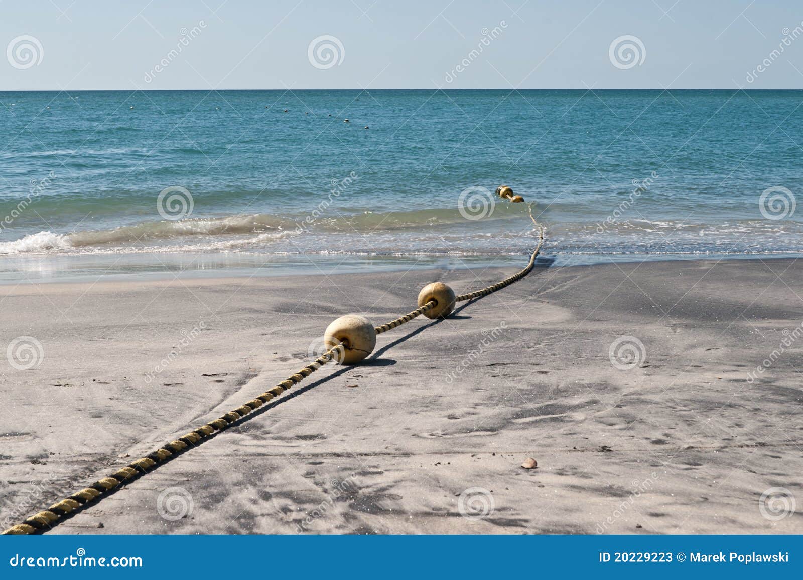 Buoys on sandy beach stock image. Image of rope, beach - 20229223
