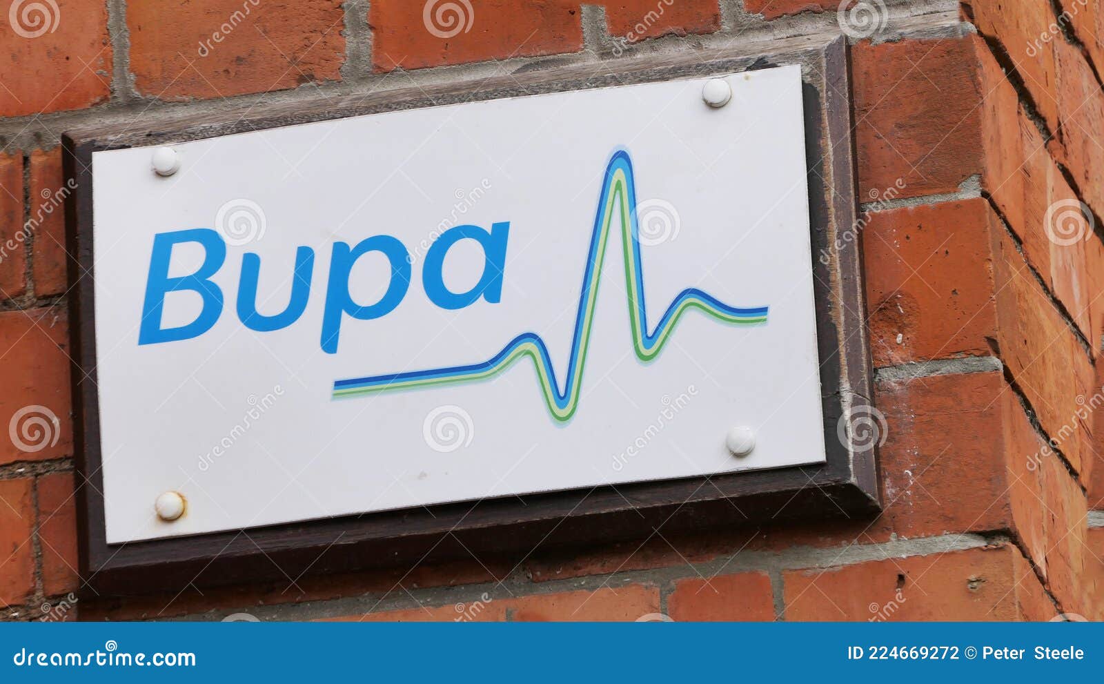 Bupa sign on brick wall editorial photography. Image of hospital ...