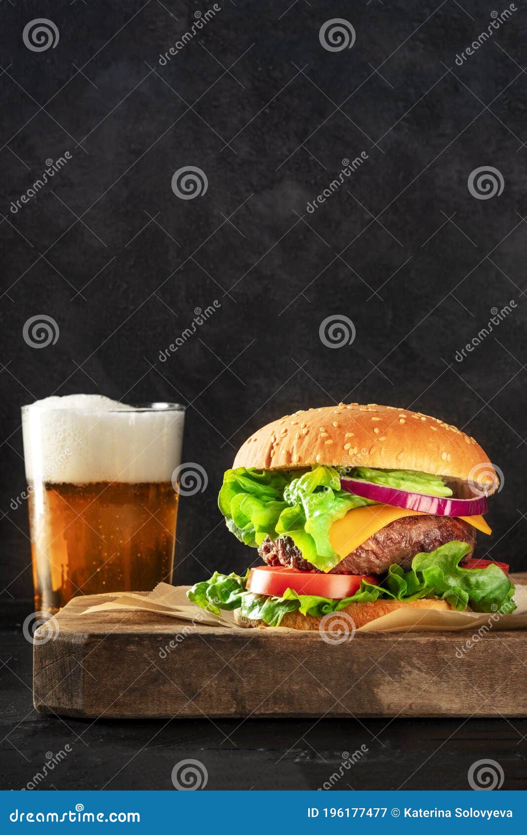 Burger and Beer, a Side View on a Dark Background with Copy Space Stock ...