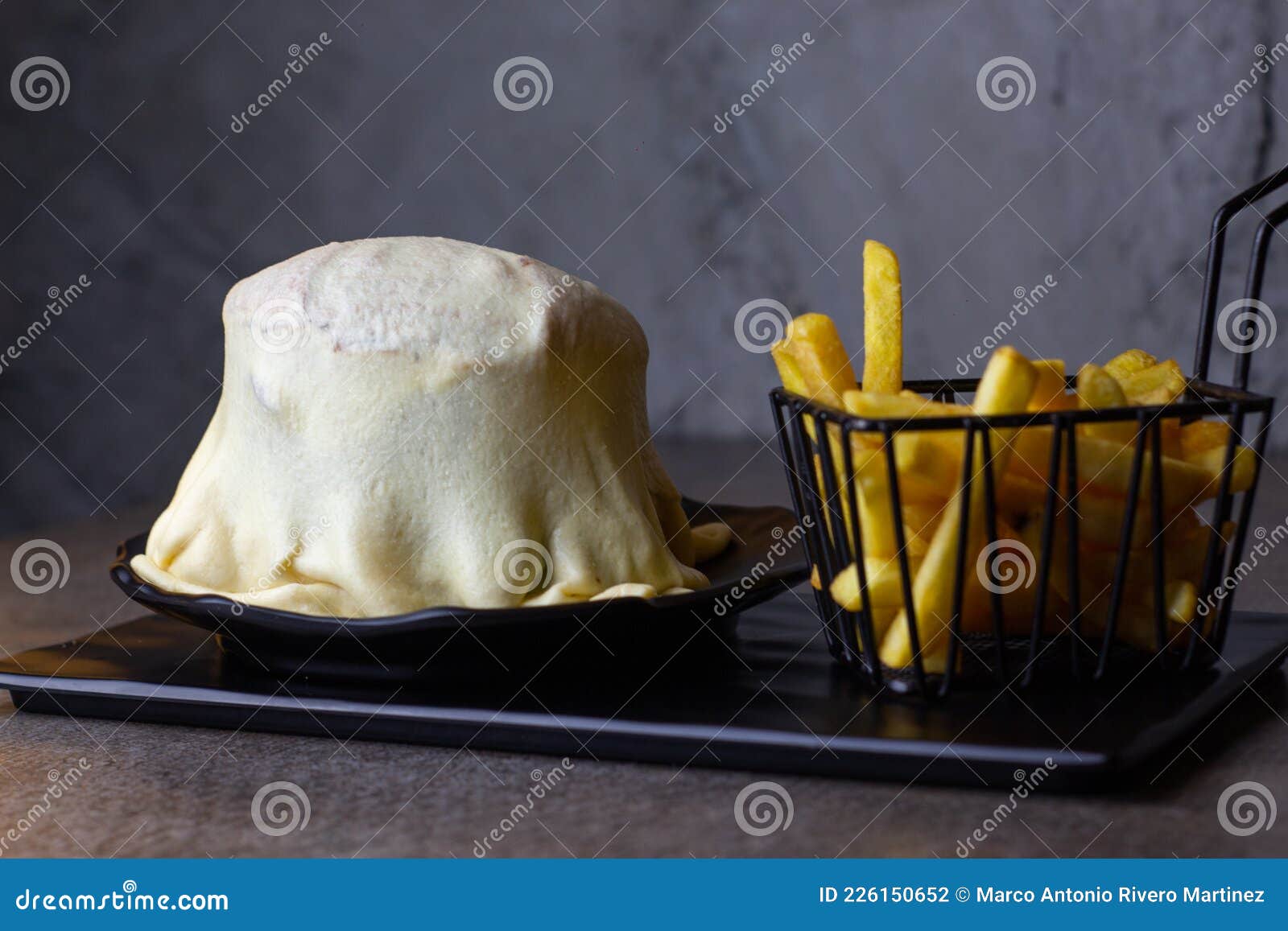 Burger Covered with Melted Cheese on a Plate Stock Photo - Image of ...