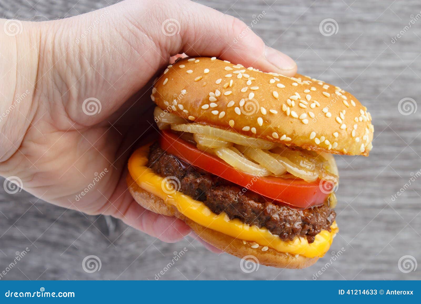 Burger in hand stock image. Image of bread, nutrition - 41214633
