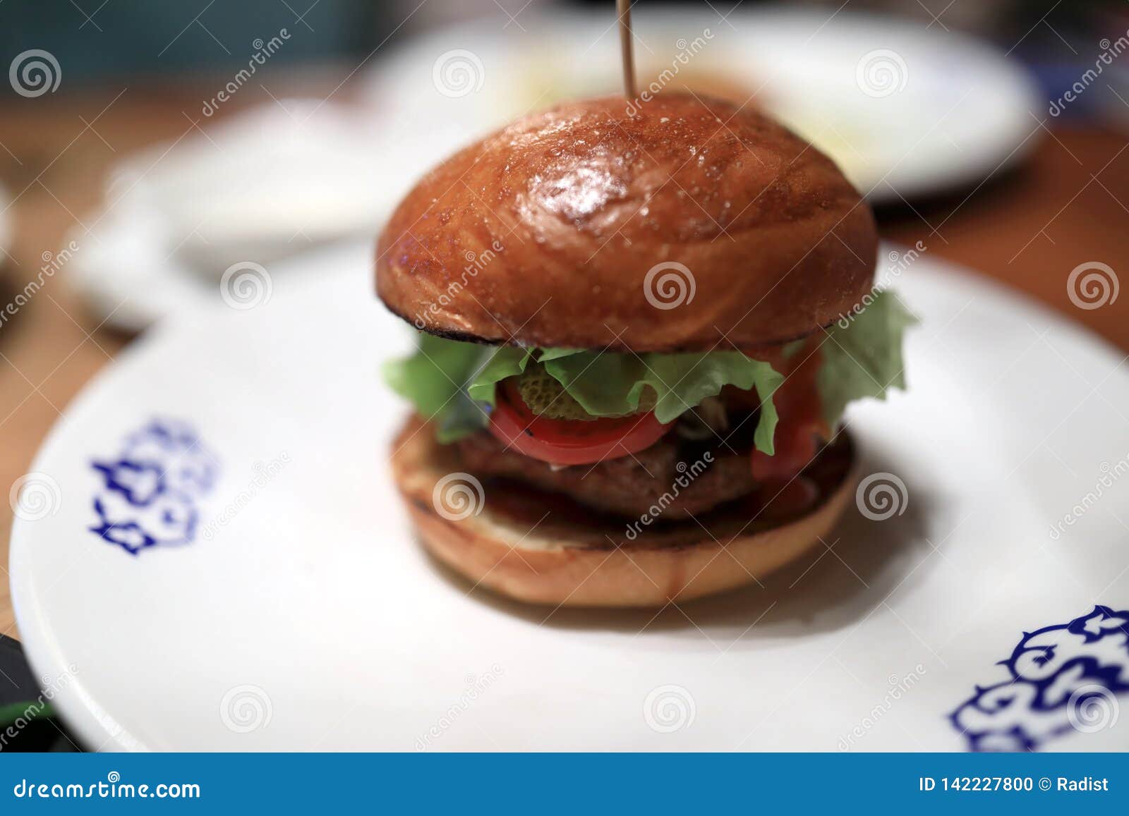 Burger on plate stock photo. Image of diner, barbecue - 142227800